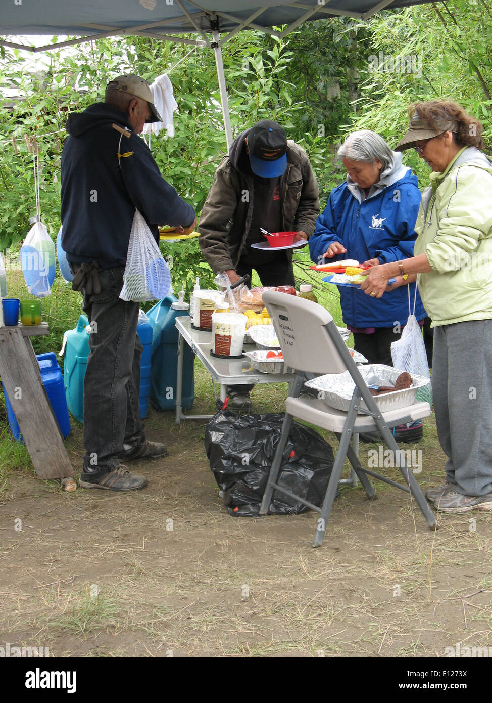 This photograph features Julia and Pollock Simon alongside Elsie and ...