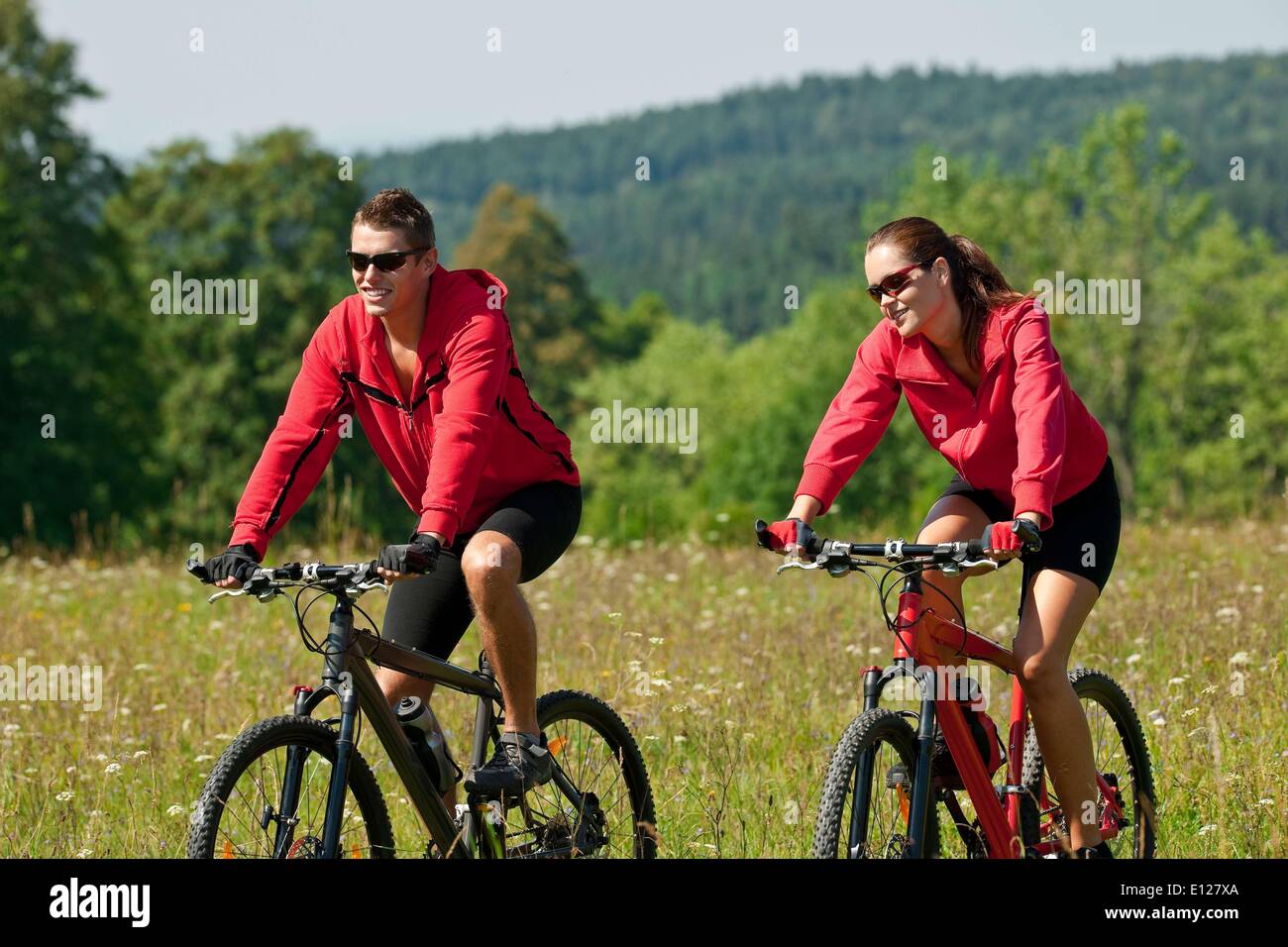 Aug. 28, 2009 - Aug. 28, 2009 - Young couple riding mountain bike in ...