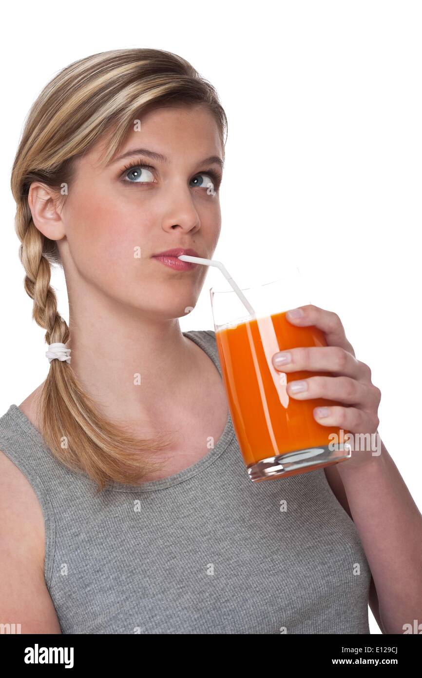 Apr. 14, 2009 - April 14, 2009 - Blond woman with carrot juice on white ...