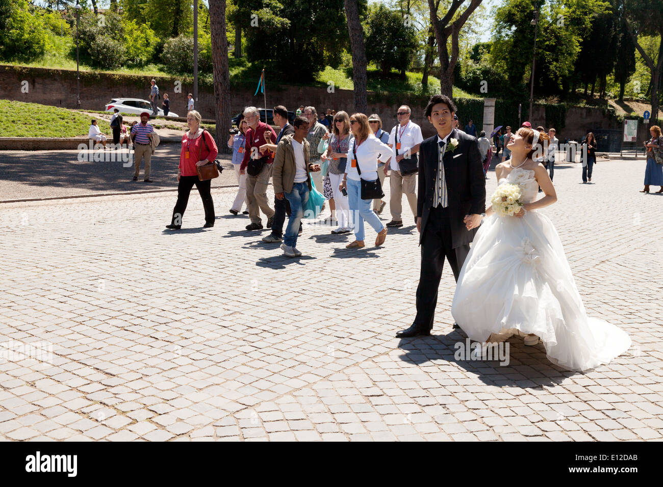 A n asian couple on their wedding day, getting married in Rome, Italy ...