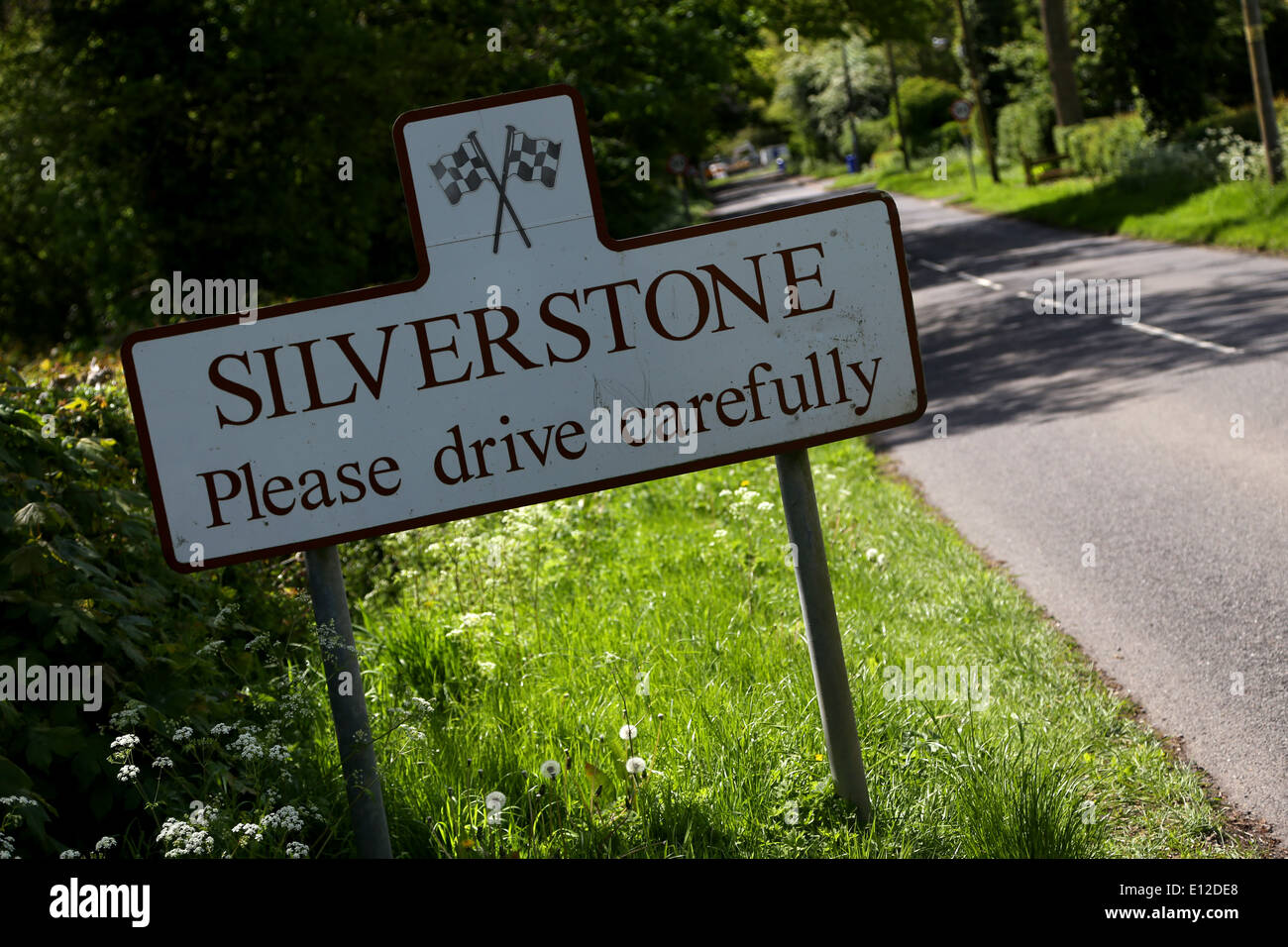 Silverstone "please drive carefully" sign Stock Photo - Alamy