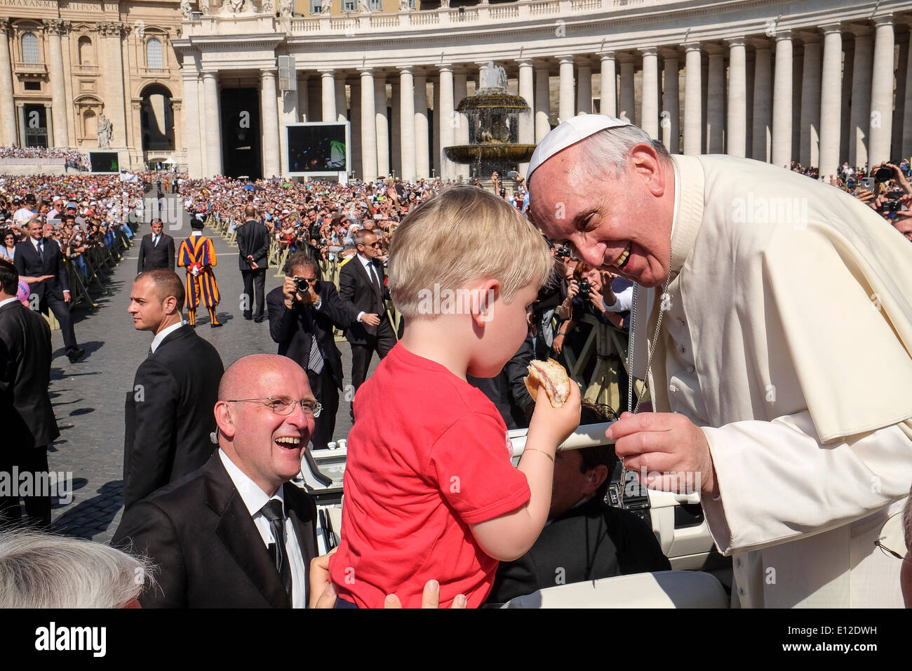 Vatican City. 21st May, 2014. A child eat a sandwich during his meeting ...