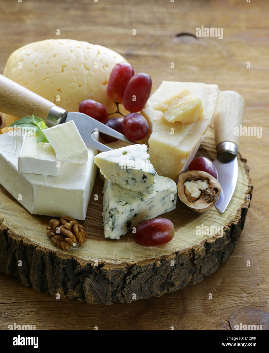 cheeseboard with assorted cheeses (parmesan, brie, blue, cheddar Stock ...