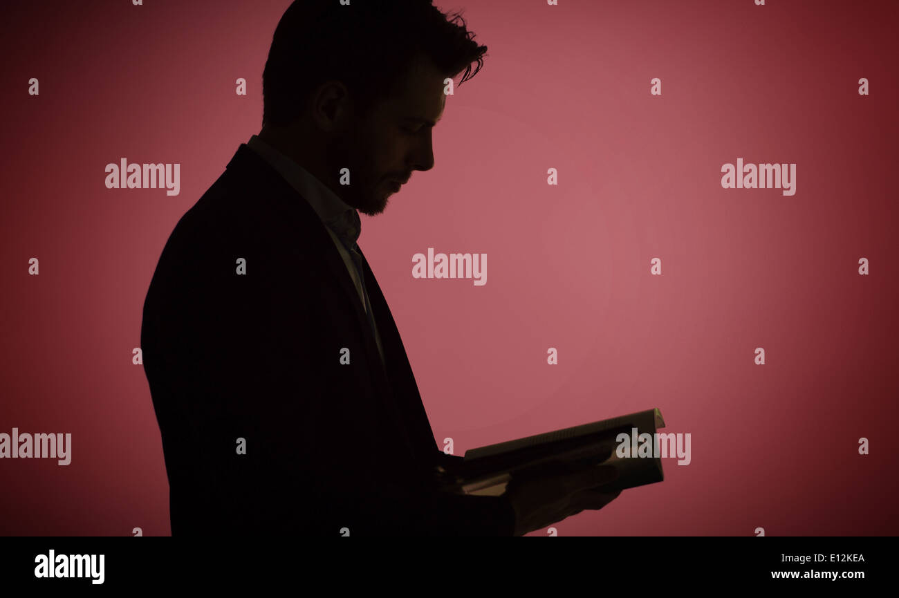 Portrait of the man reading a comic book Stock Photo - Alamy