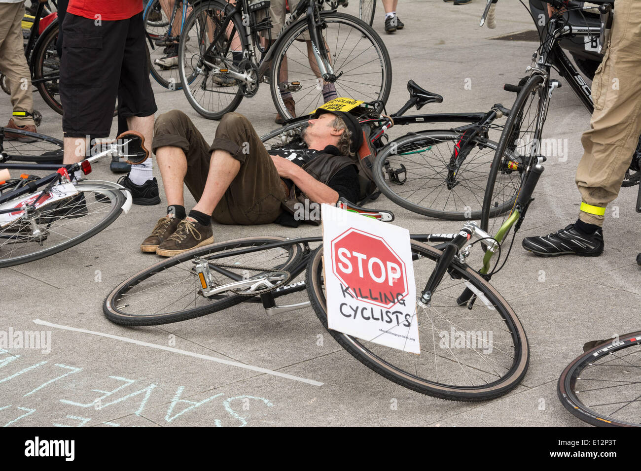 London UK. 21st May 2014. Cyclists hold a mass rally and die-in on the ...