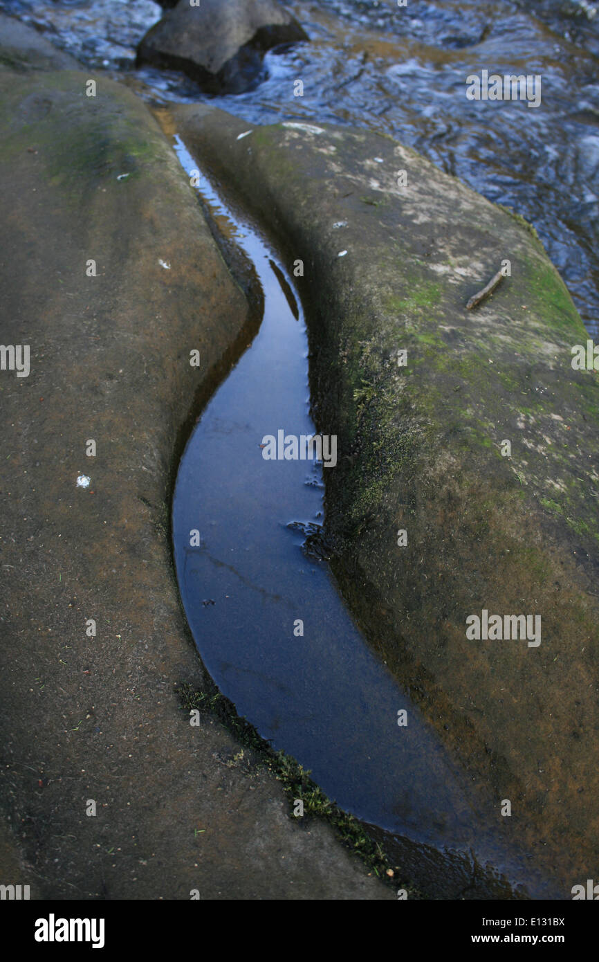 Stone shapes cut by river Stock Photo - Alamy
