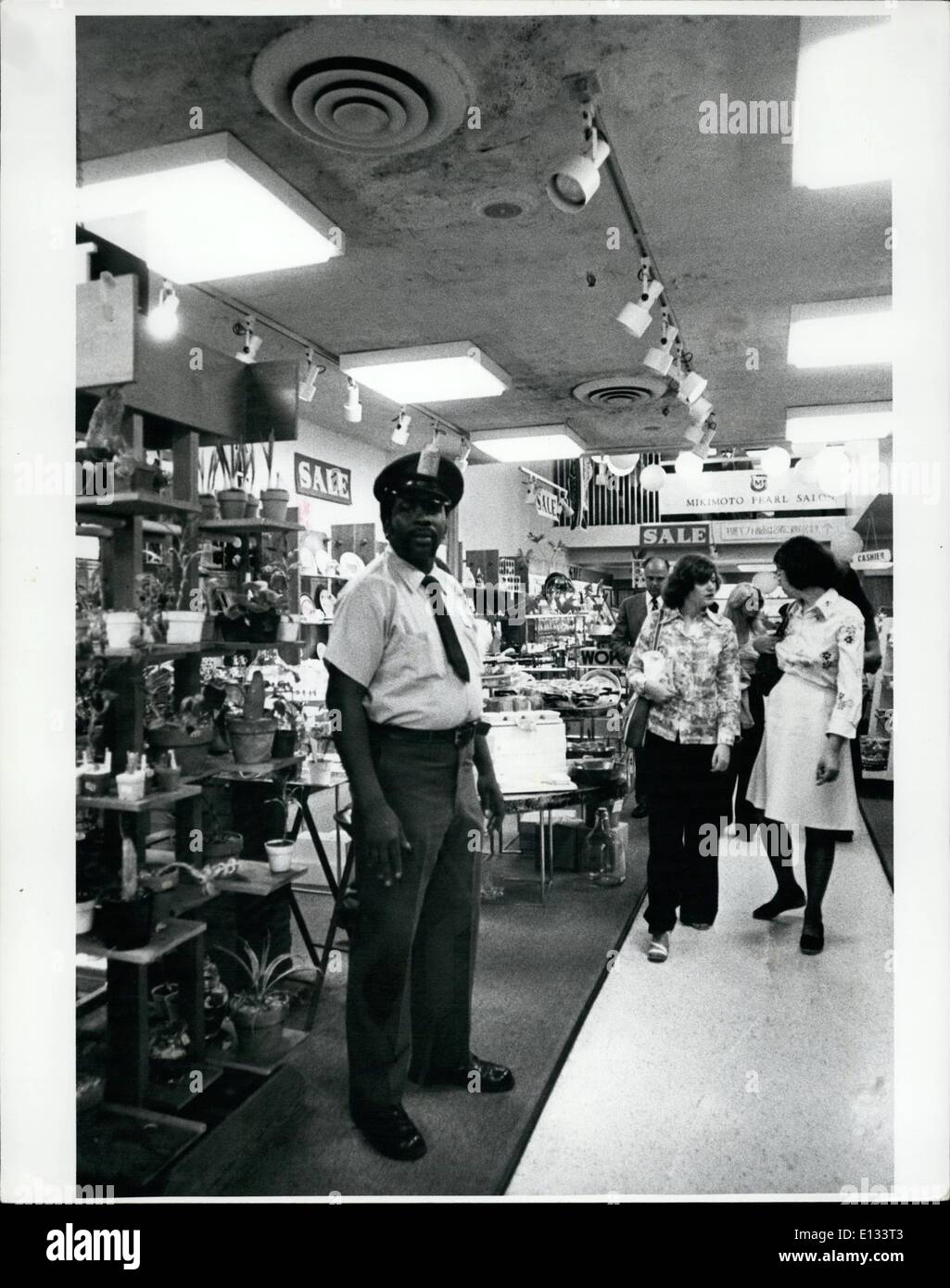 Feb. 26, 2012 - A security guard watches over shoppers in Takashimaya ...