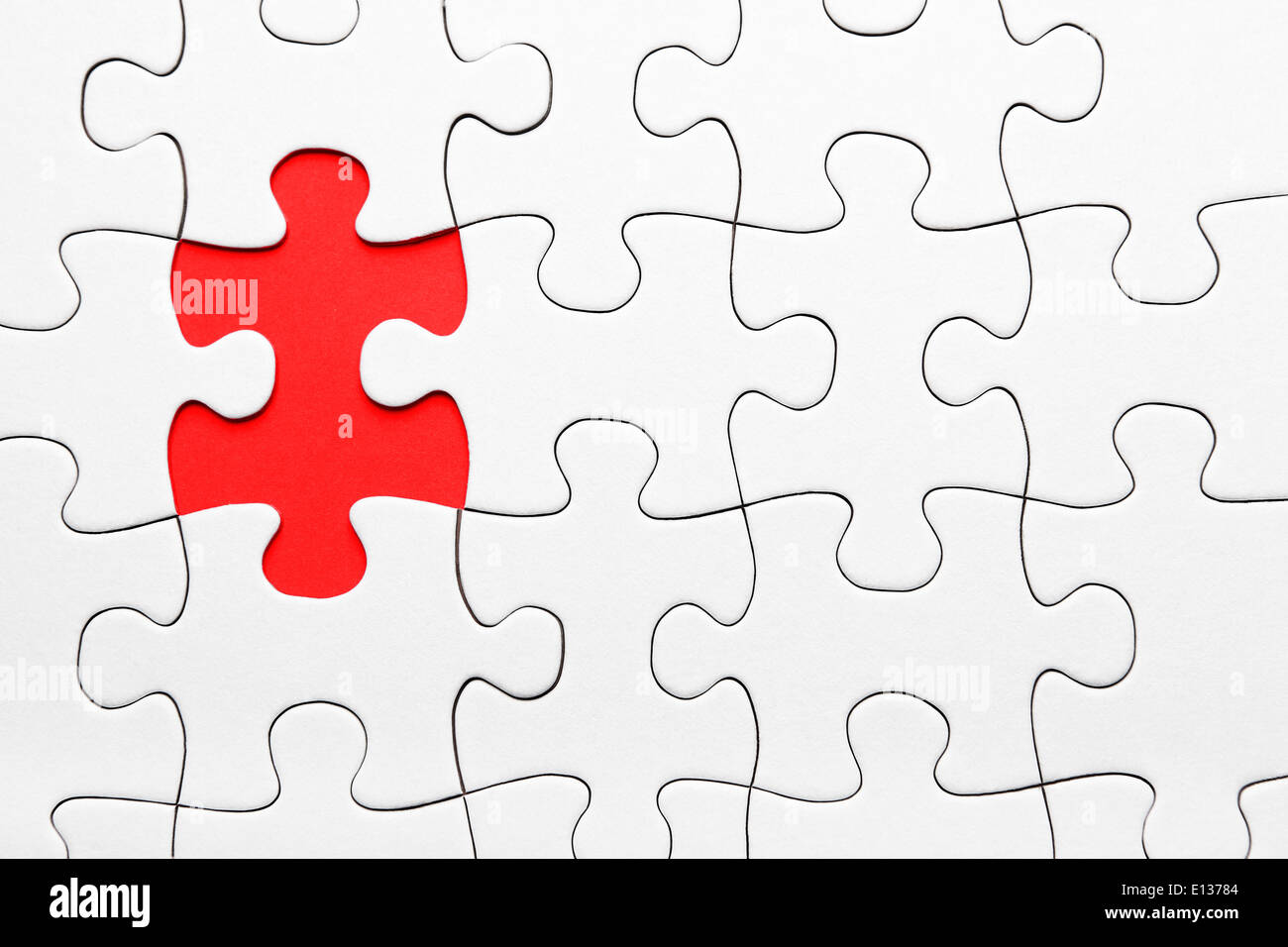 Red puzzle piece missing on white background Stock Photo - Alamy