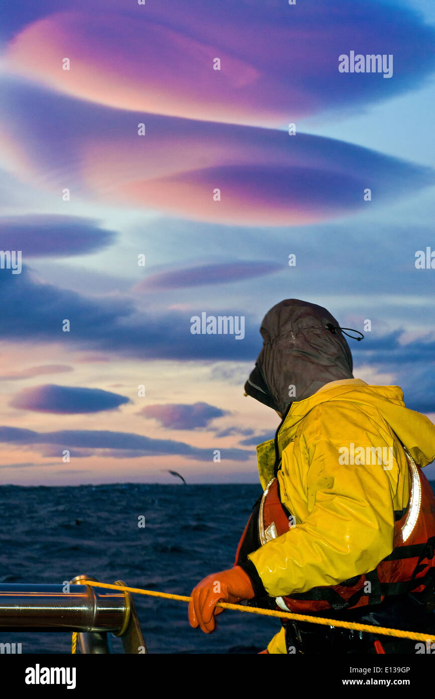 Long lining fishing under lenticular clouds in Alaska provides a unique ...