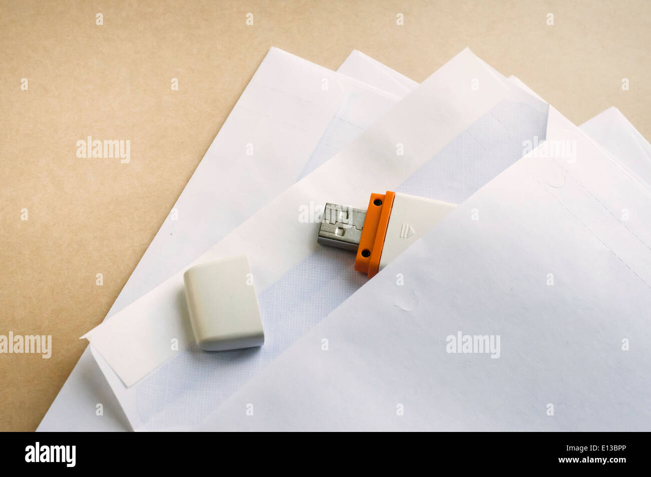 Stacked envelopes and flash drives Stock Photo - Alamy