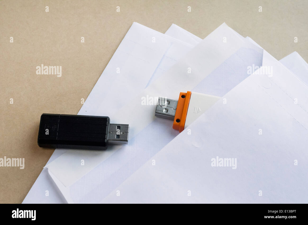 Stacked envelopes and flash drives Stock Photo - Alamy