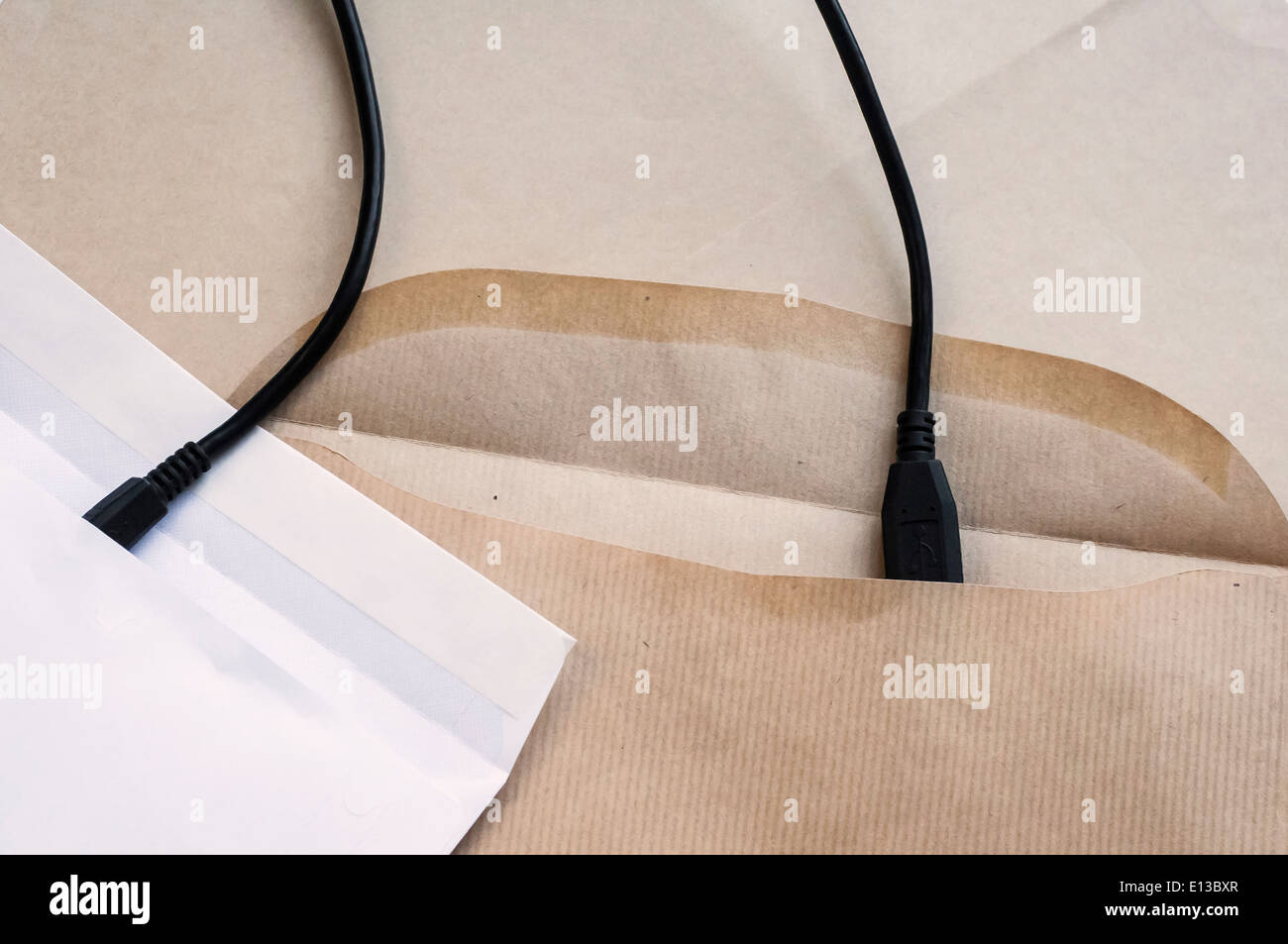 Two paper envelopes symbolically connected with interface cable Stock ...
