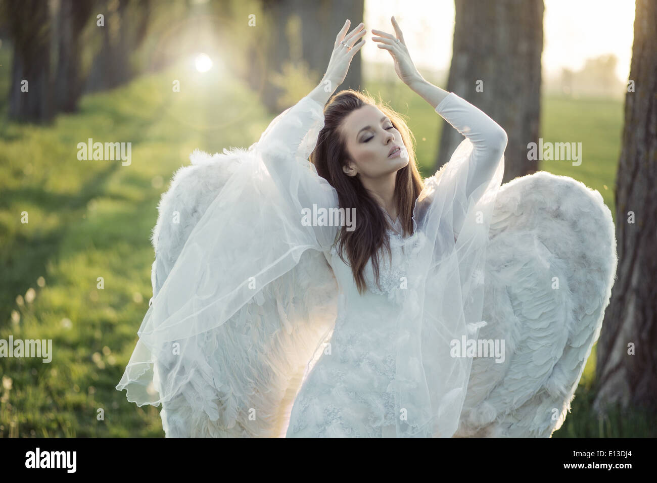 Wonderful angel dancing in the wild forest Stock Photo - Alamy