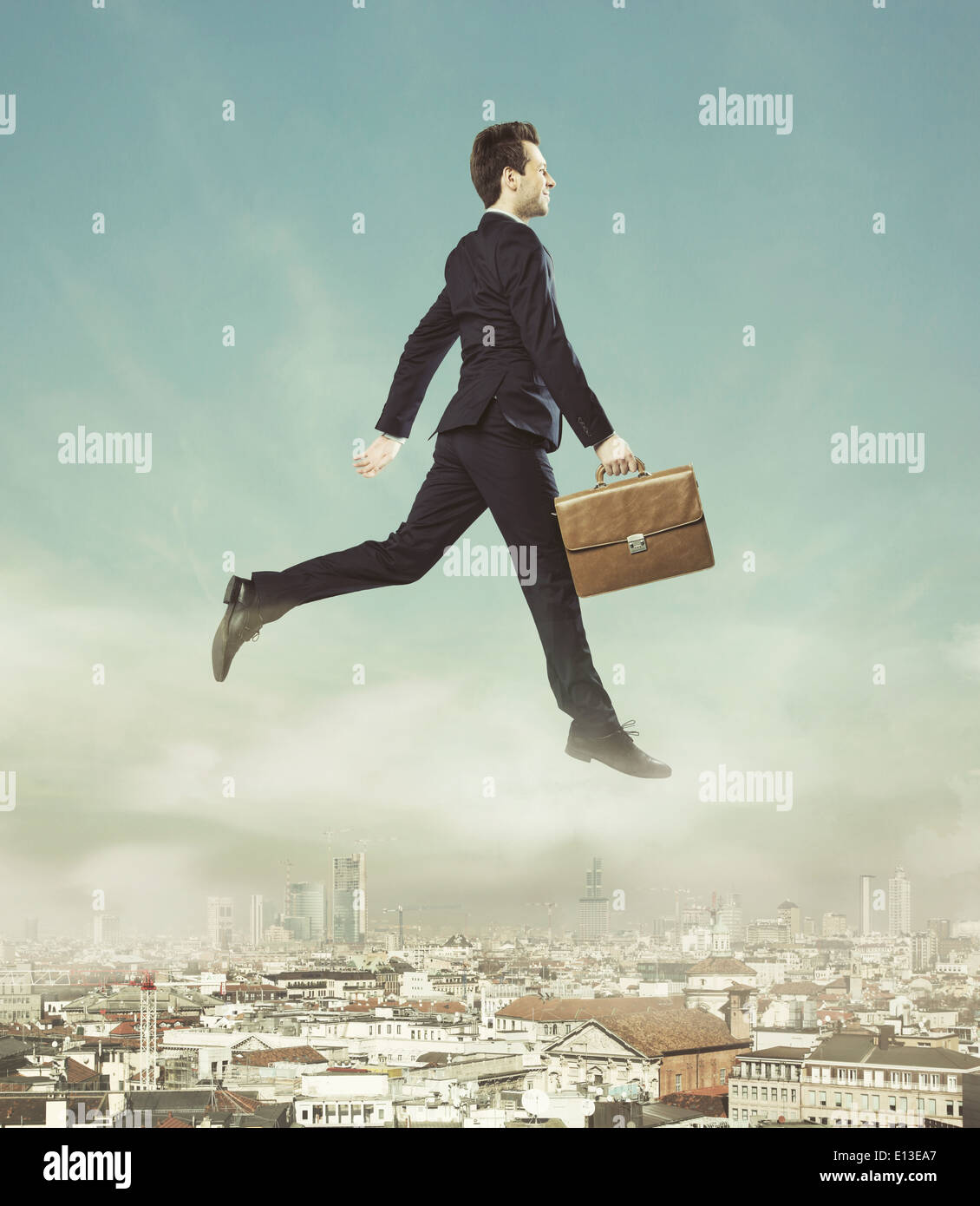 Conceptual photo of jumping businessman Stock Photo - Alamy