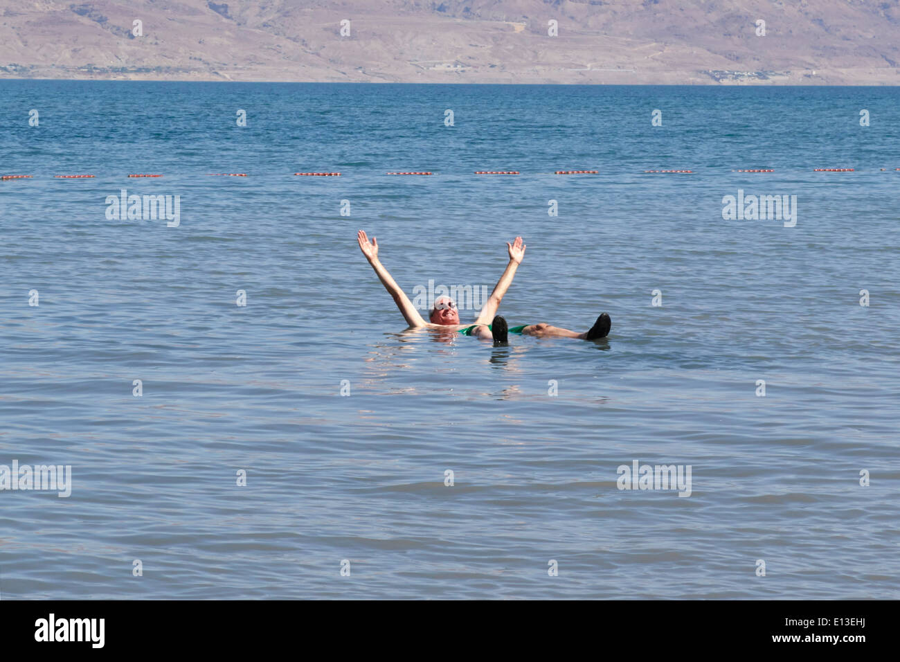 Man floating in the Dead Sea, Israel Stock Photo - Alamy