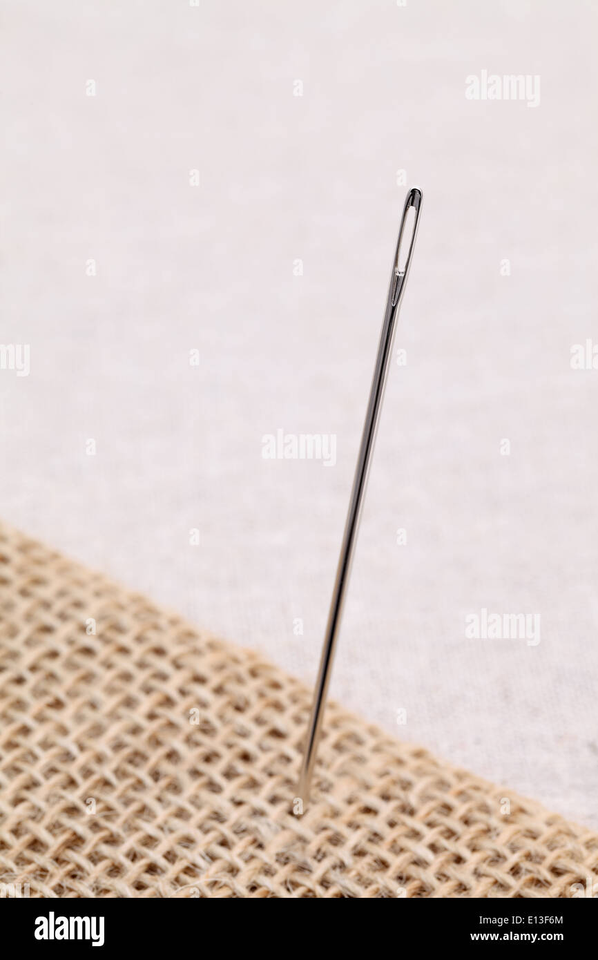 sewing needle on burlap fabric Stock Photo - Alamy