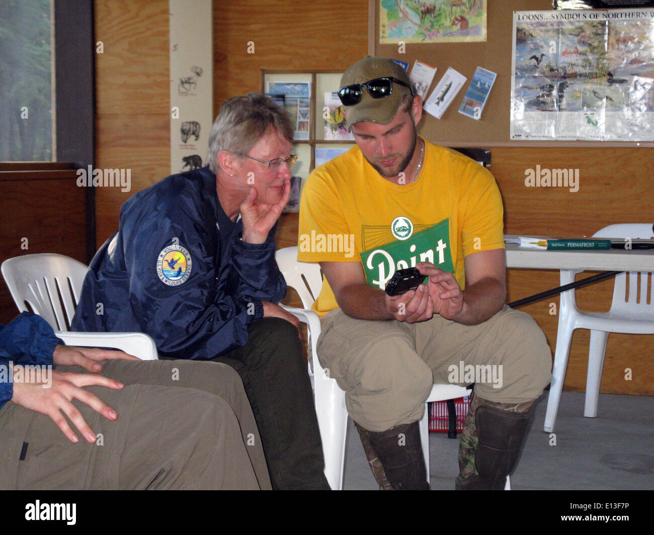 A volunteer group participates in an outdoor conservation project in ...