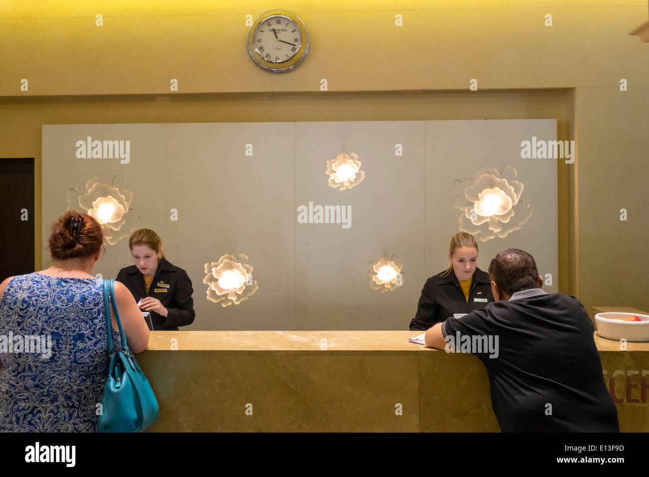 Female hotel employee helping guest hi-res stock photography and images ...
