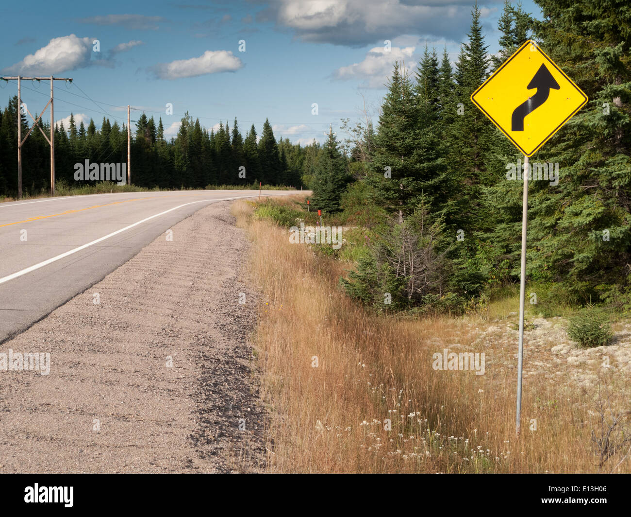 Double bend warning road sign hi-res stock photography and images - Alamy
