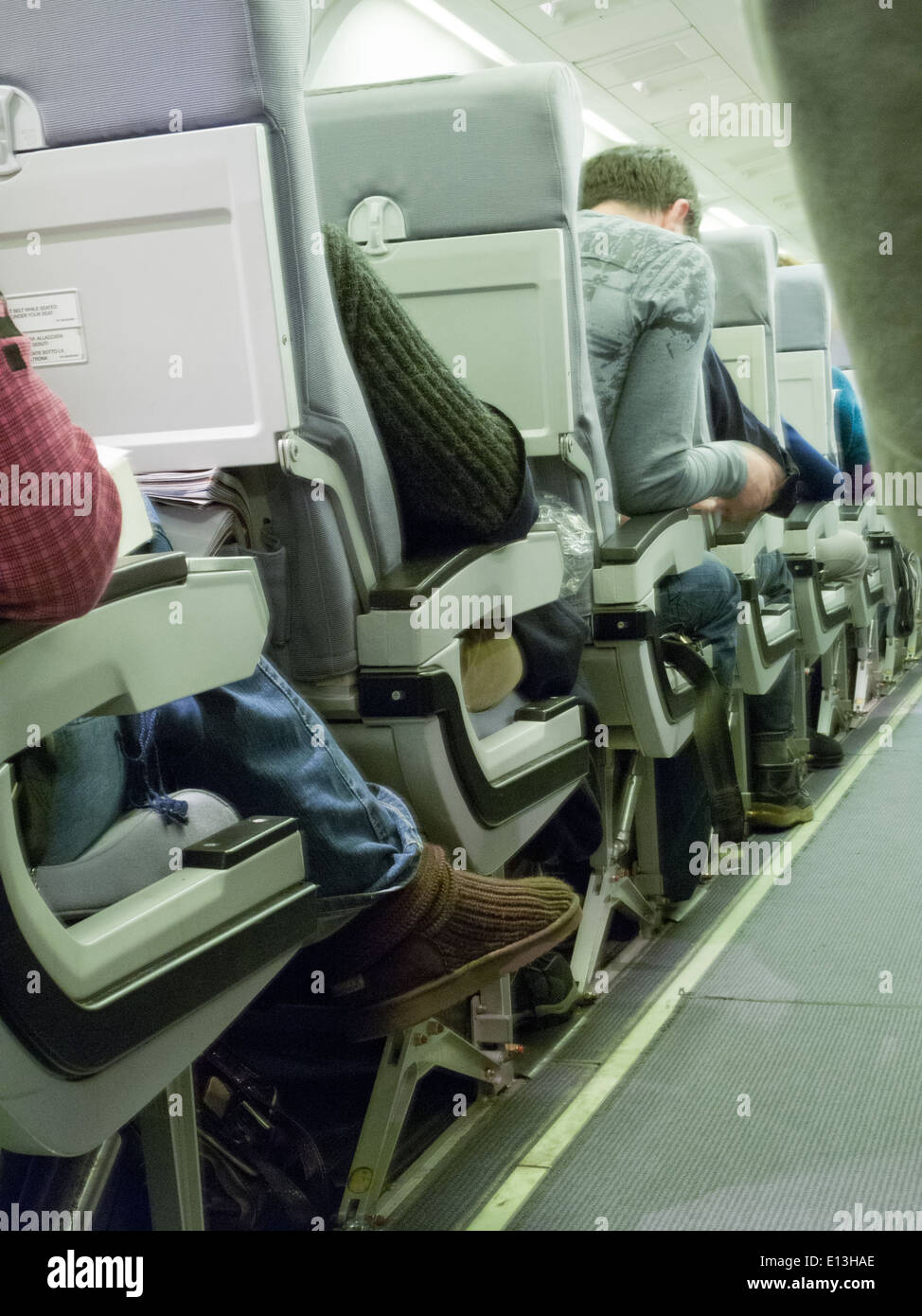 Passengers sitting in an airplane Stock Photo - Alamy