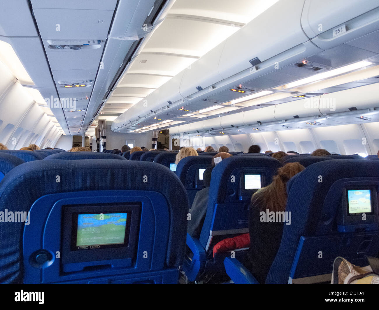 Passengers sitting in an airplane Stock Photo - Alamy