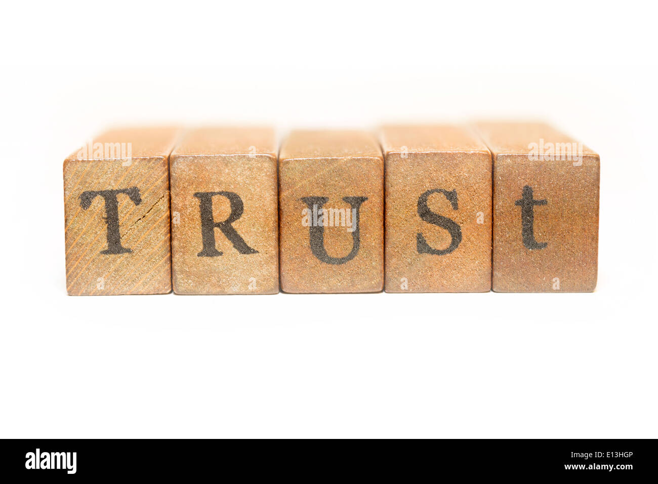 trust word made from wooden bricks isolated on white Stock Photo - Alamy