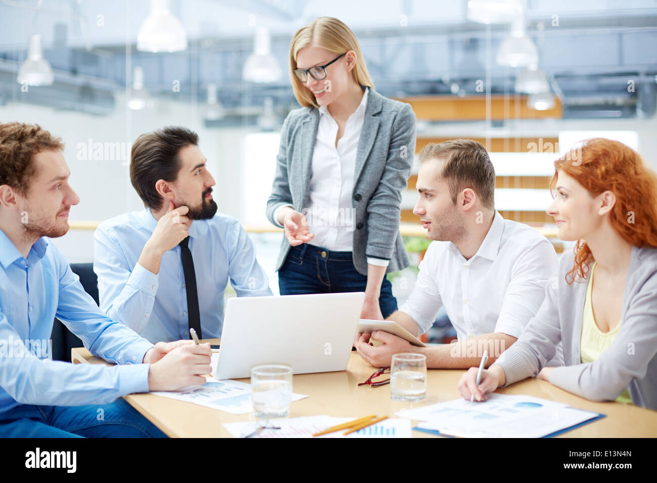 Business team approving his colleague’s idea about company’s ...