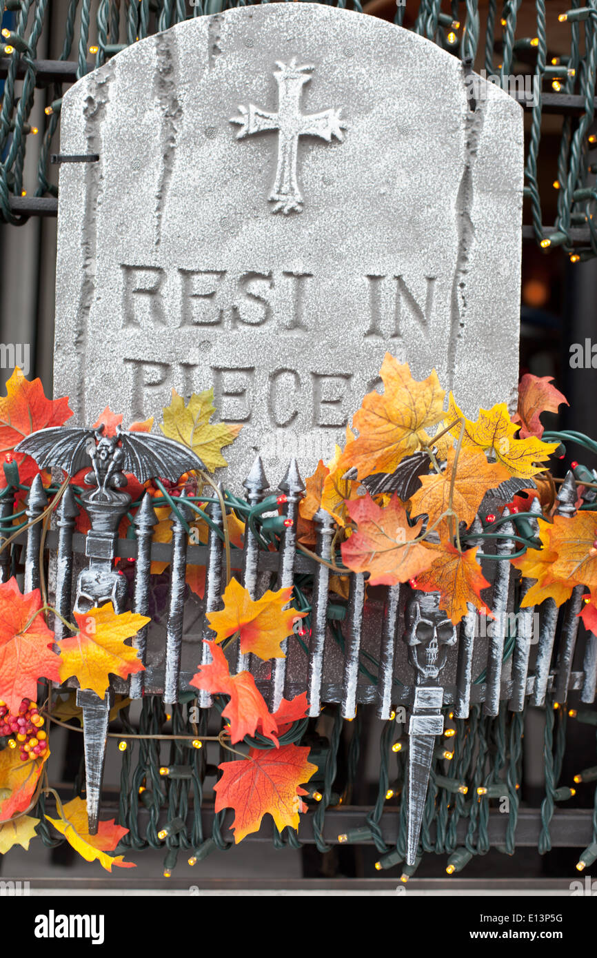 Statue of gravestone at a window basket Stock Photo - Alamy