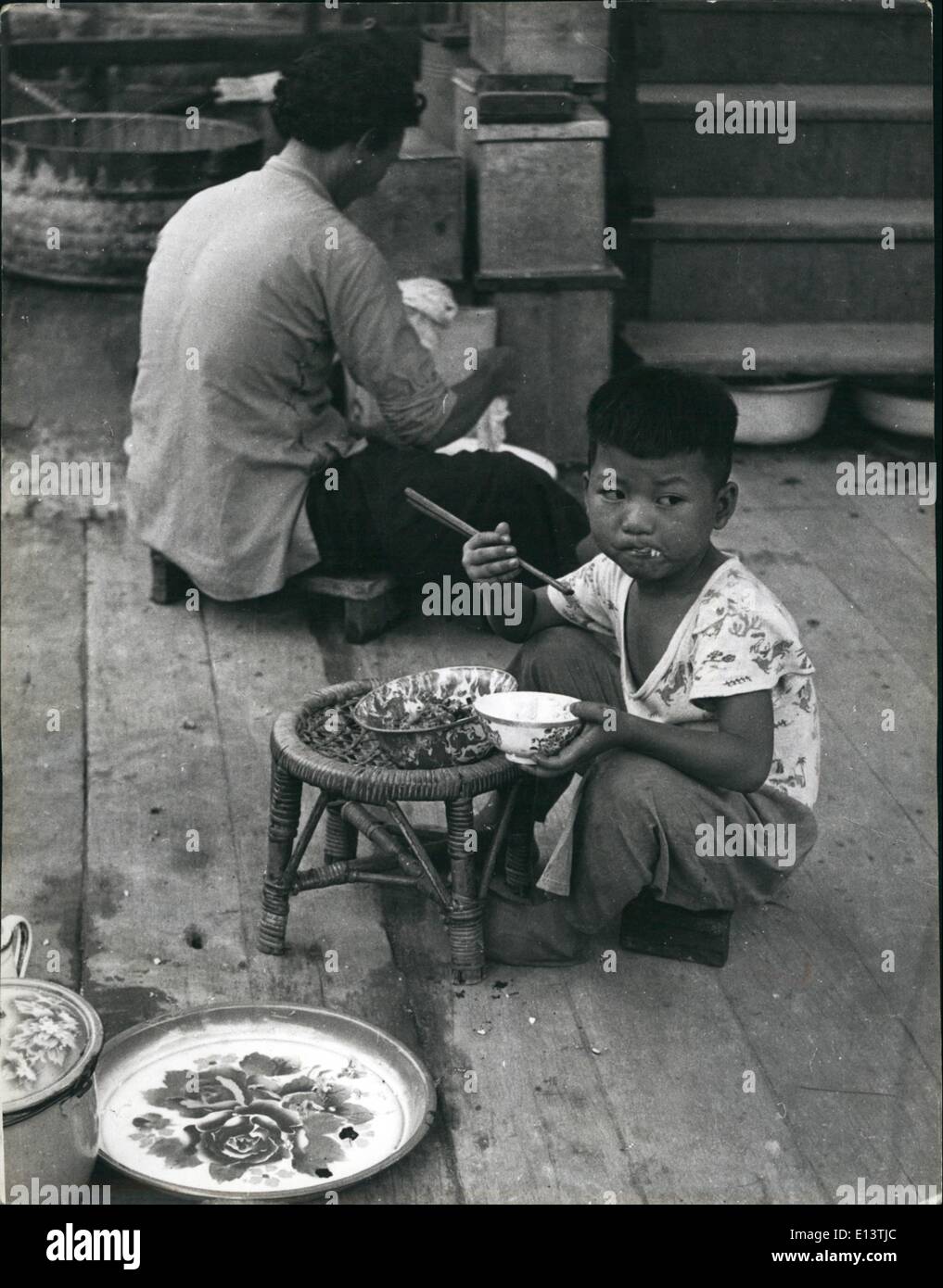 Mar. 27, 2012 - the little refugee boy at his bowl of rice keeps his ...