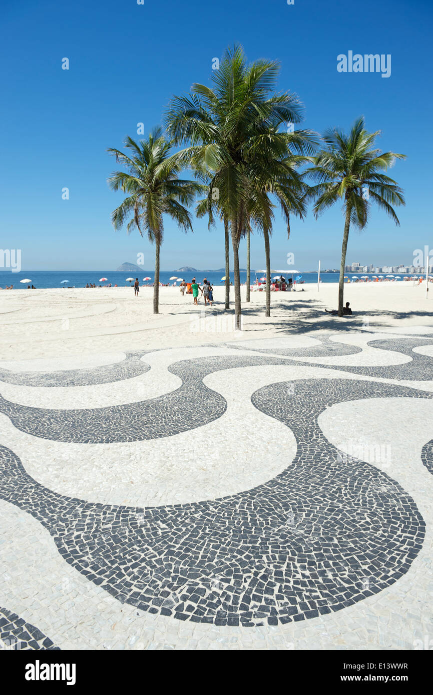 Iconic sidewalk tile pattern with palm trees at empty view of ...