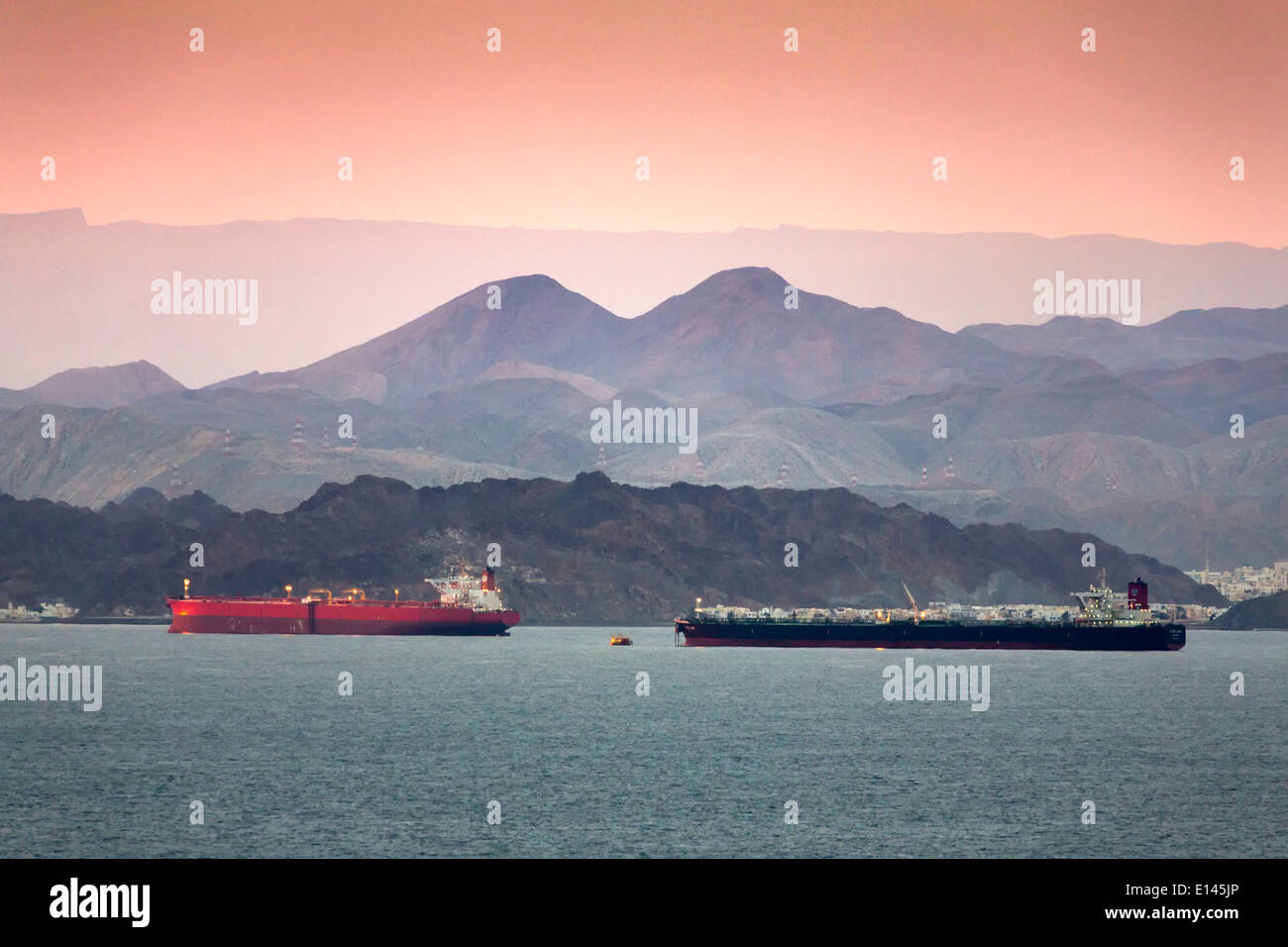 Oman, Muscat, Harbor Mina As Sultan Qaboos. Cargo ships waiting at ...