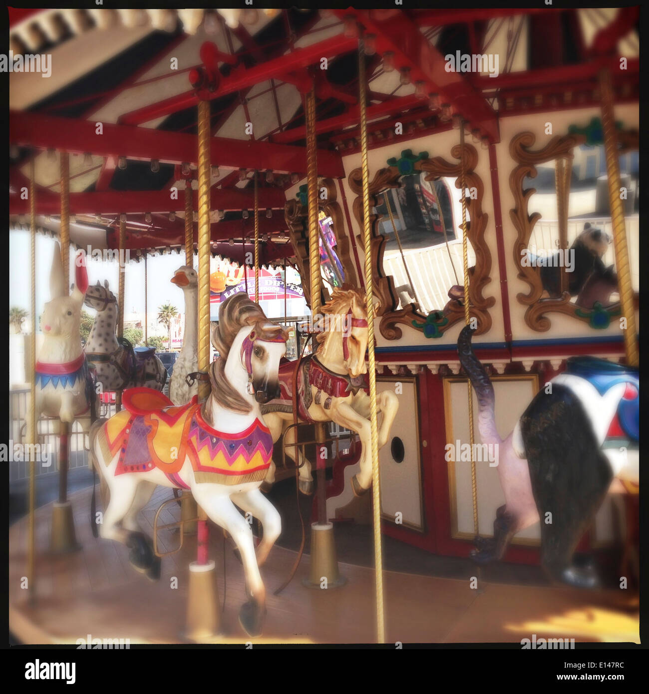 Carousel at amusement park Stock Photo - Alamy