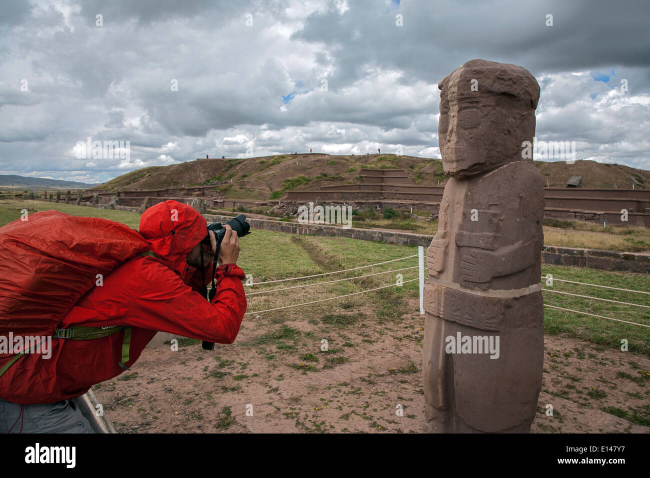 Tourist photographing the Fraile monolith. Kalasasaya Temple. Tiwuanaku ...