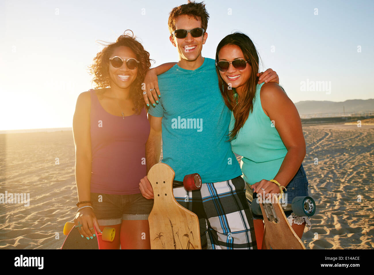 Beach sunglasses standing smiling hi-res stock photography and images ...