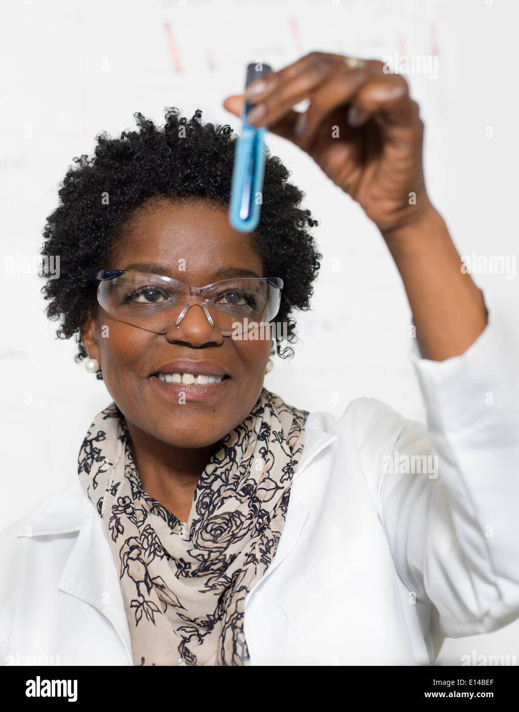 Black scientist examining sample in lab Stock Photo - Alamy