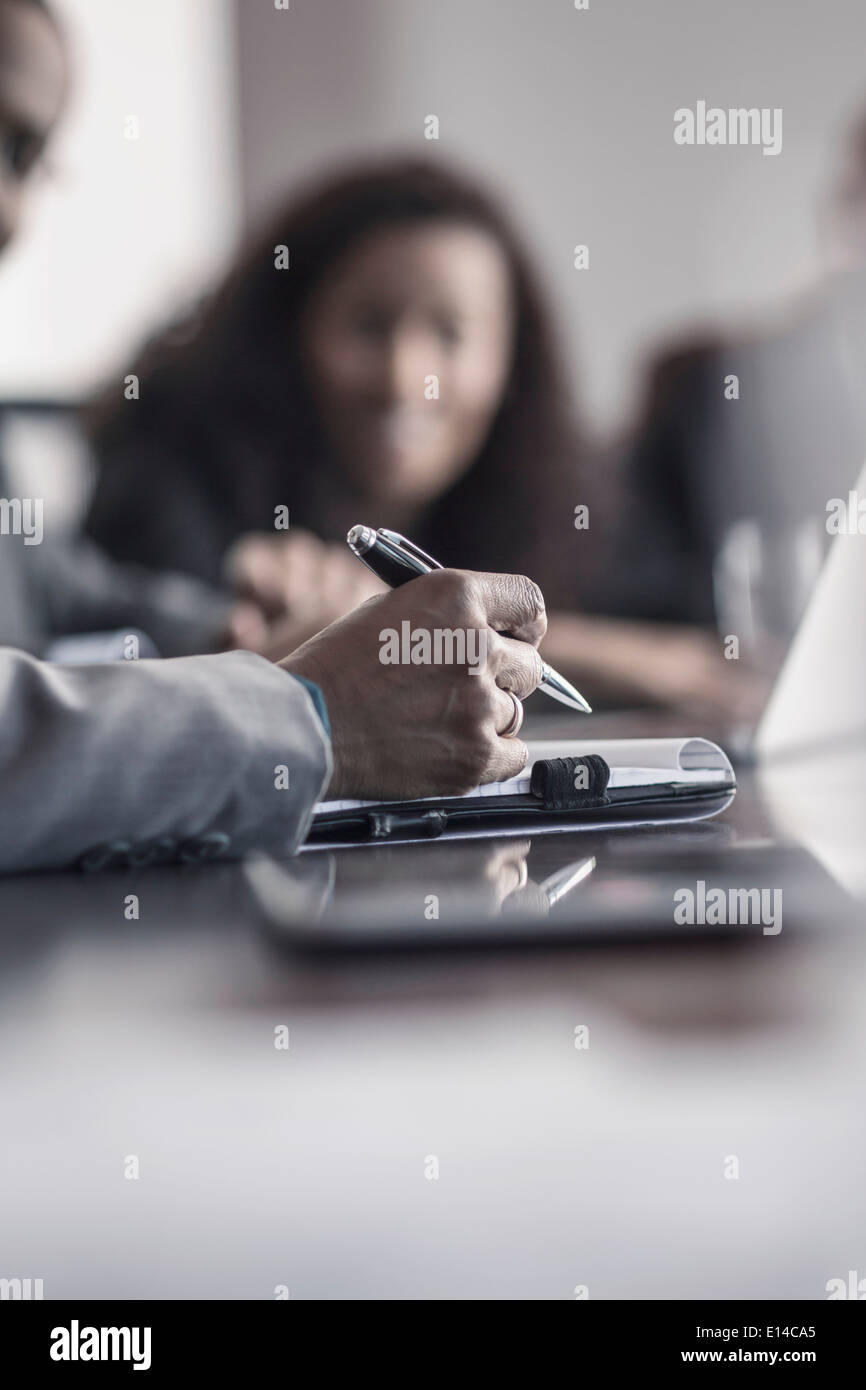 Businesspeople sitting taking notes woman hi-res stock photography and ...
