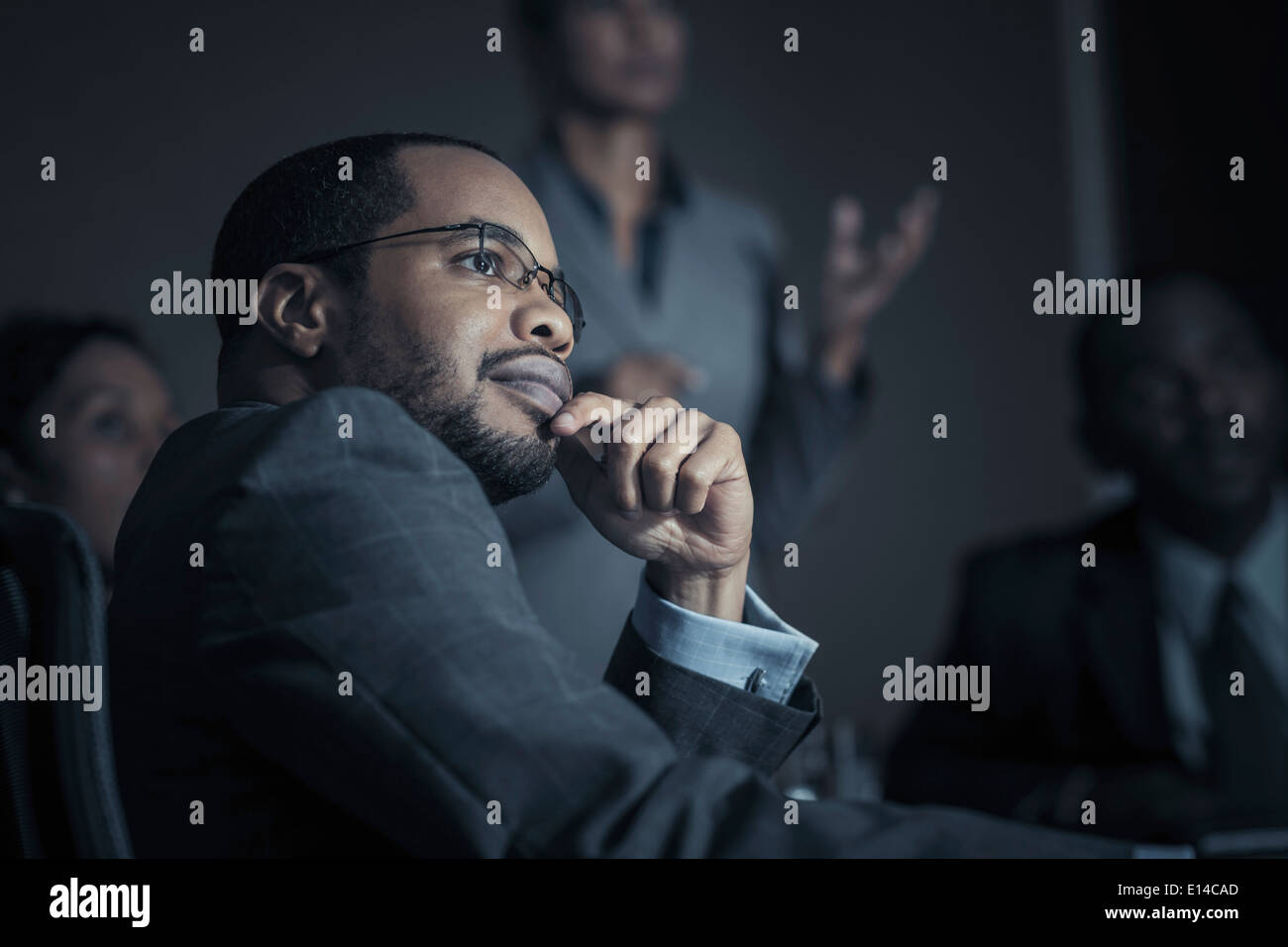 Business people watching projection in meeting Stock Photo - Alamy