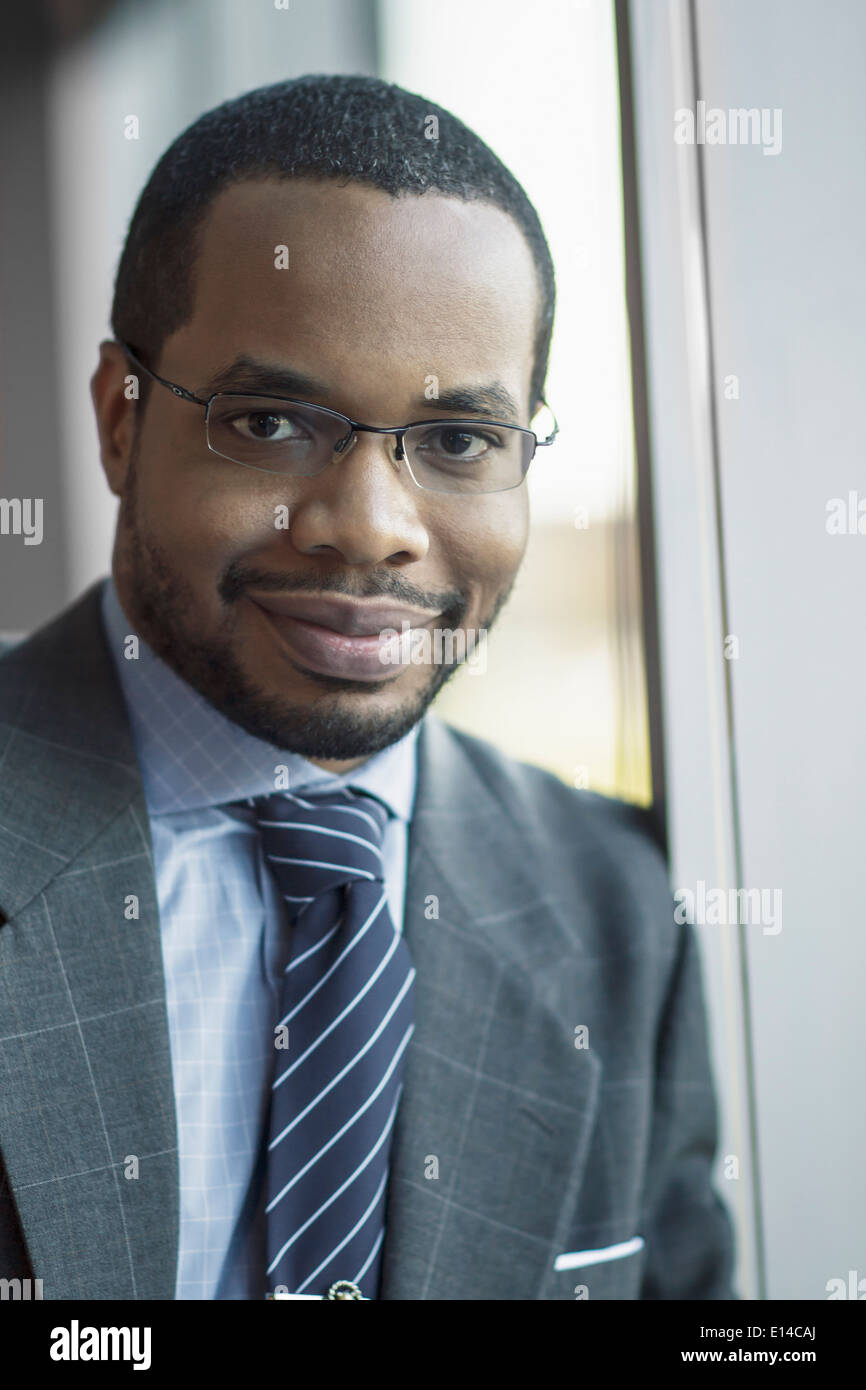 Mixed race businessman smiling hi-res stock photography and images - Alamy