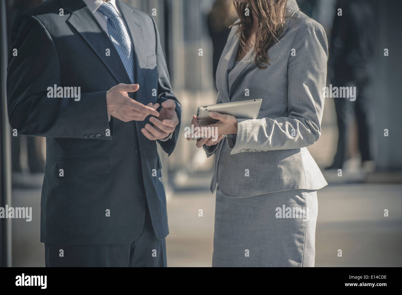Business people talking outside Stock Photo - Alamy