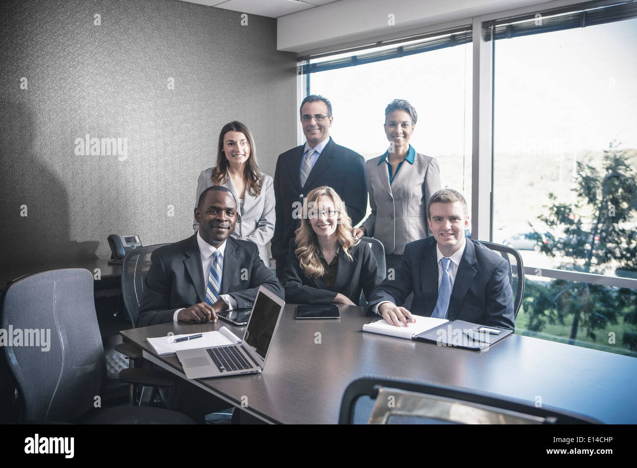 Business people smiling in meeting Stock Photo - Alamy