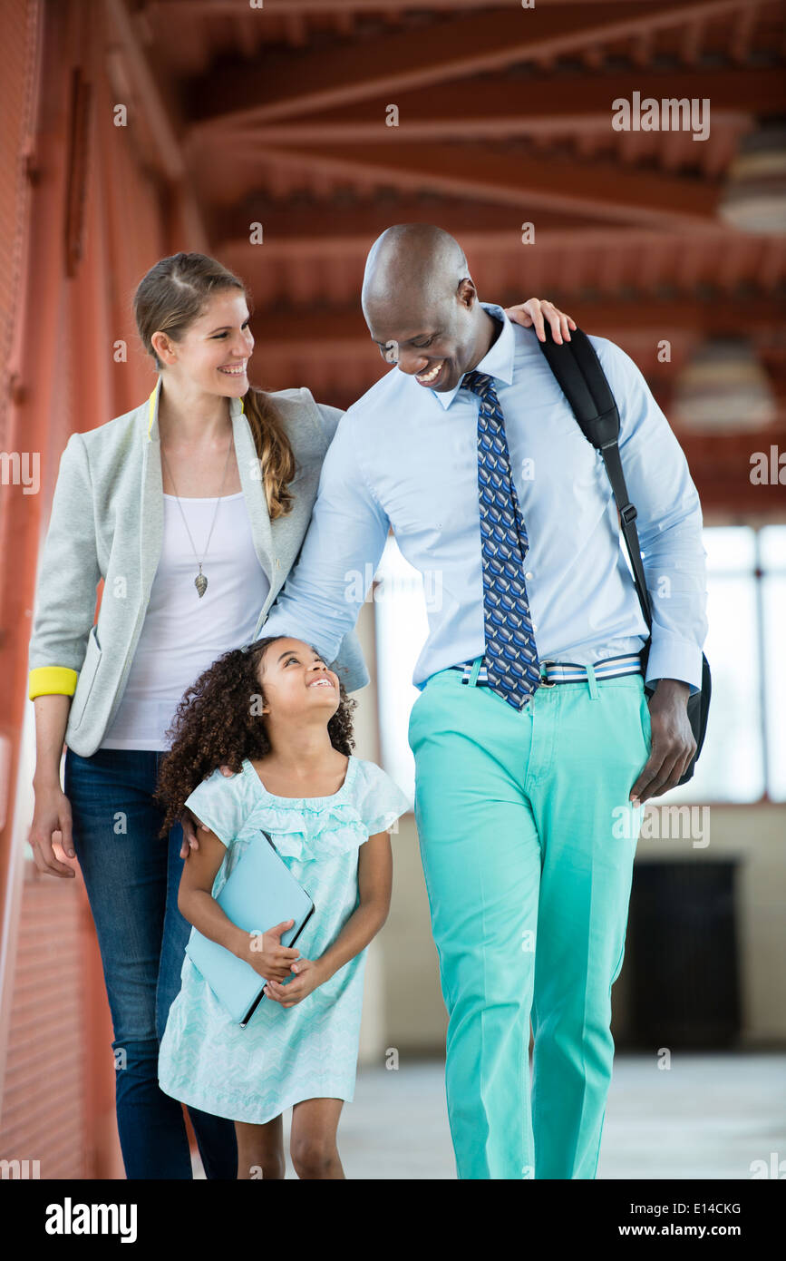 Family walking together on walkway Stock Photo - Alamy