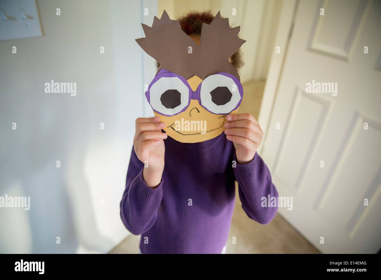 Holding mask over his face hi-res stock photography and images - Alamy