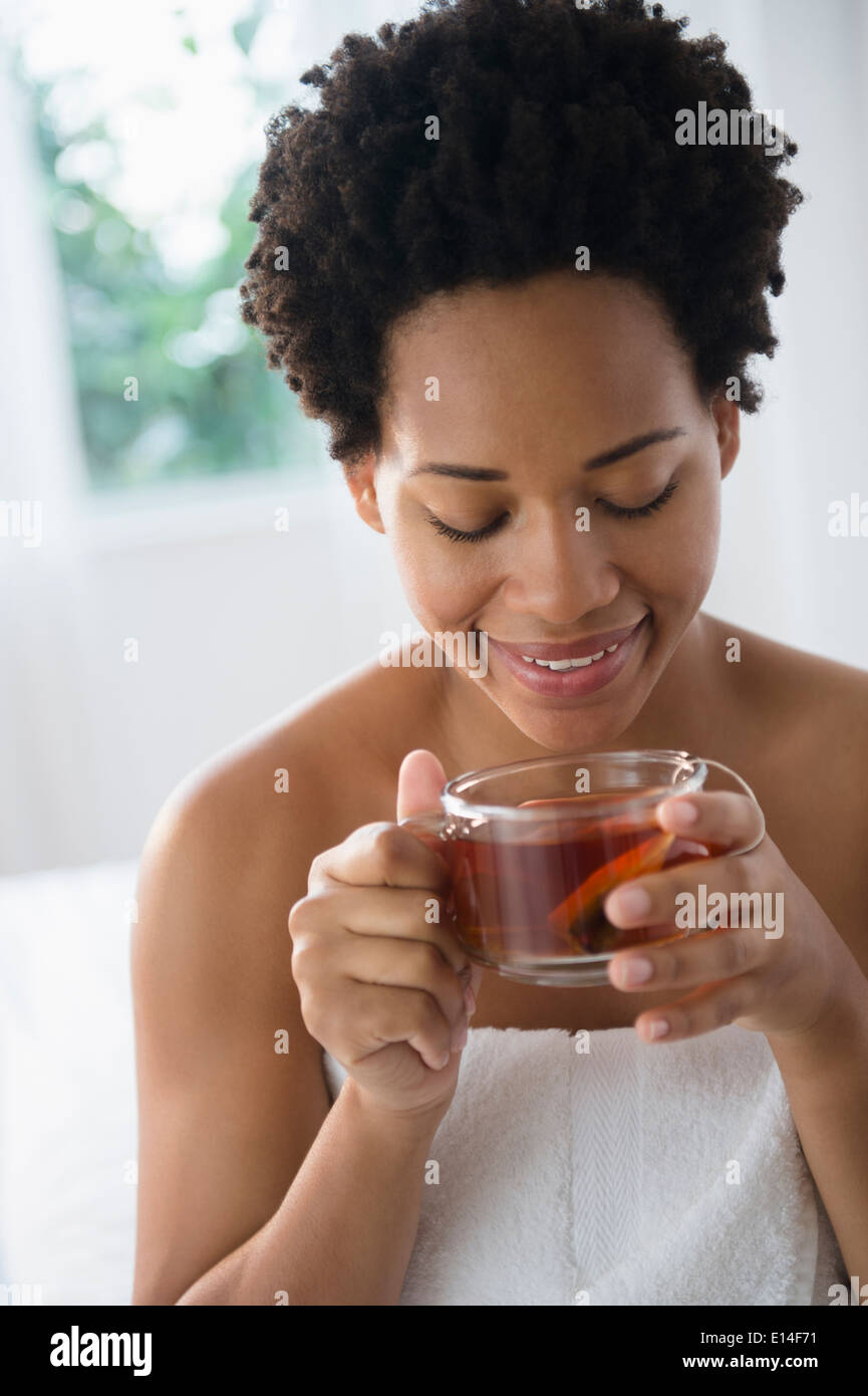 Close up of Black woman enjoying tea Stock Photo - Alamy