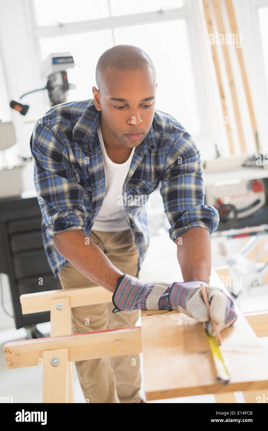 Black carpenter working in workshop hi-res stock photography and images ...
