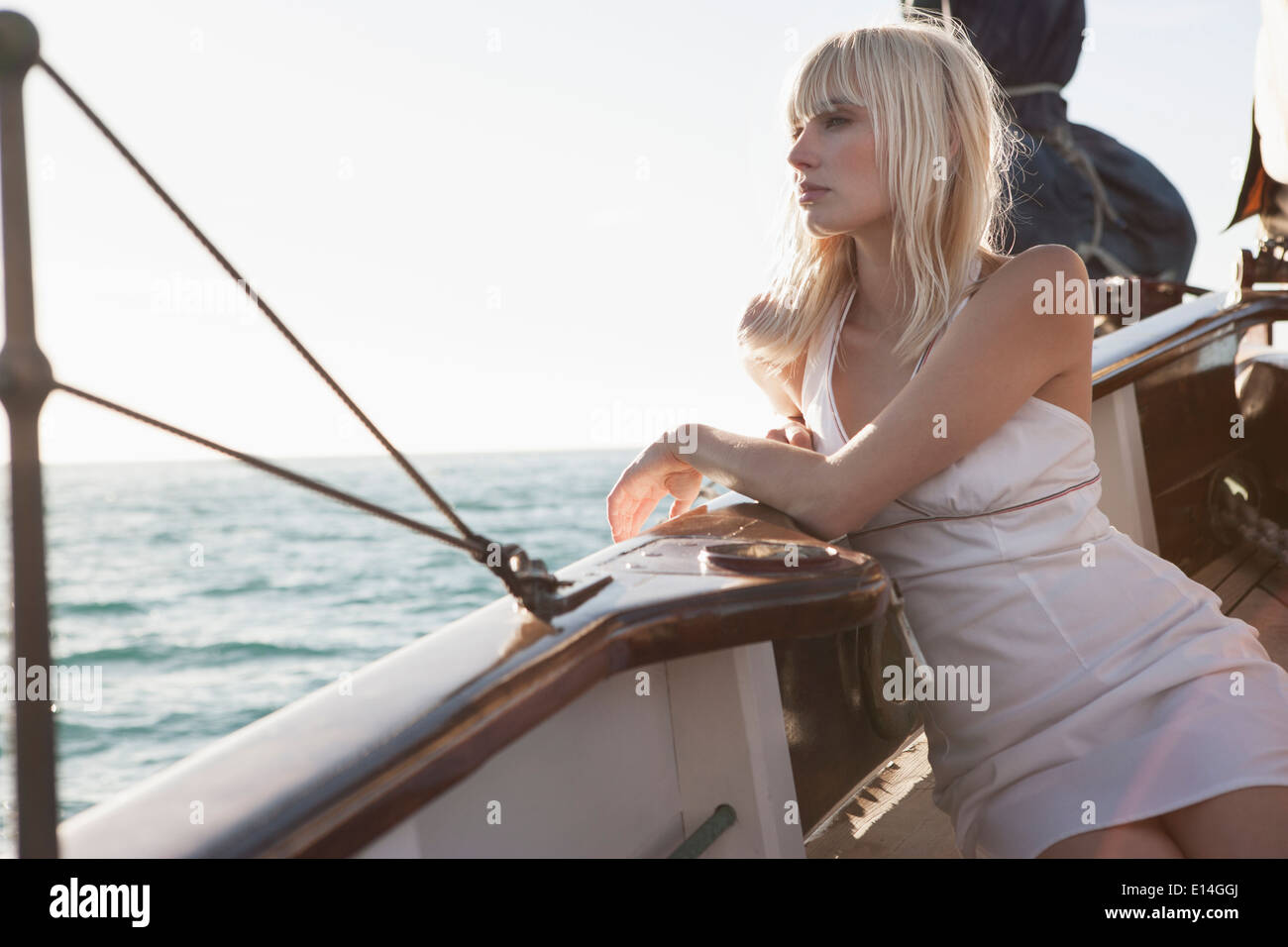 Blonde woman relaxing on boat hi-res stock photography and images - Alamy