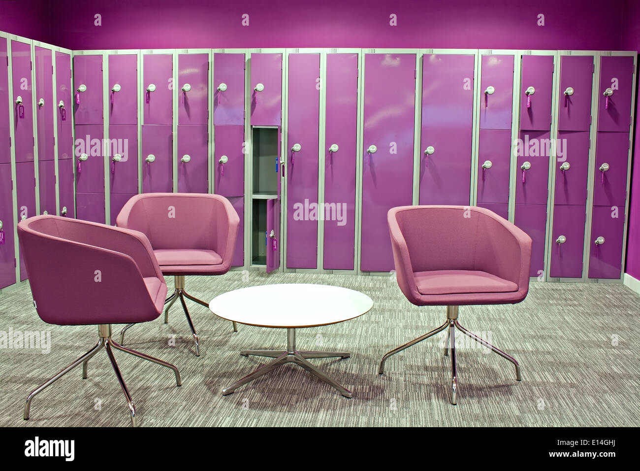 Modern meeting area with lockers in purple theme Stock Photo - Alamy