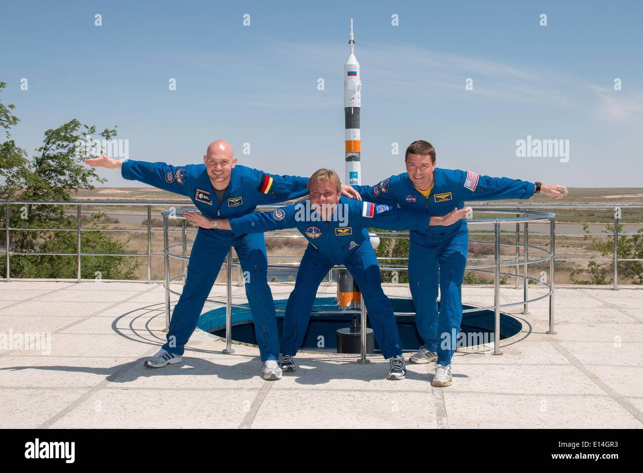 ISS Expedition 41 crews members mimic a pose taken years ago by a ...