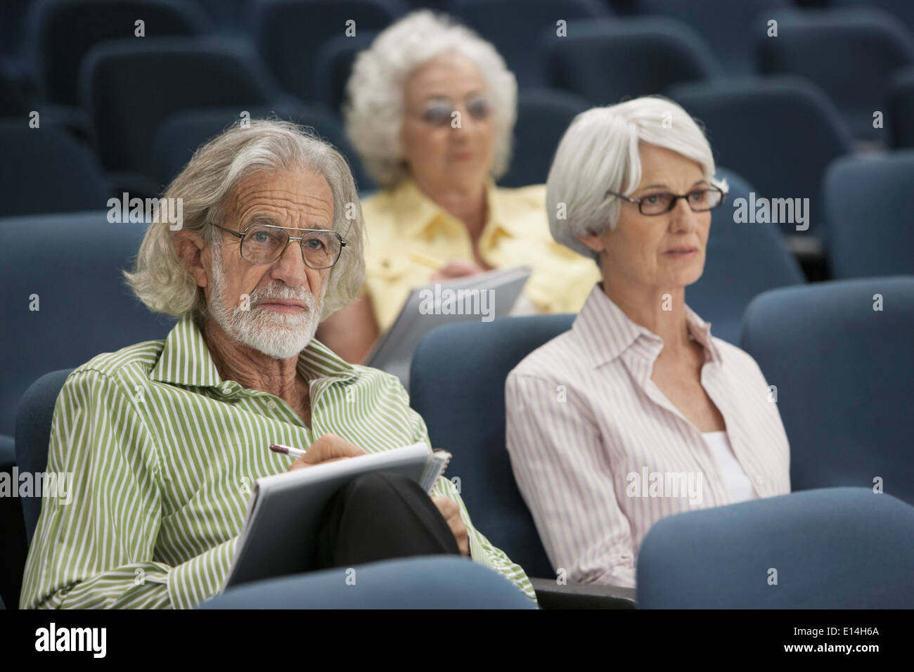 Adult sitting in classroom seat hi-res stock photography and images - Alamy