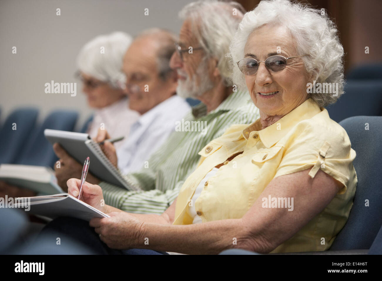 Senior Caucasian students taking notes in classroom Stock Photo - Alamy