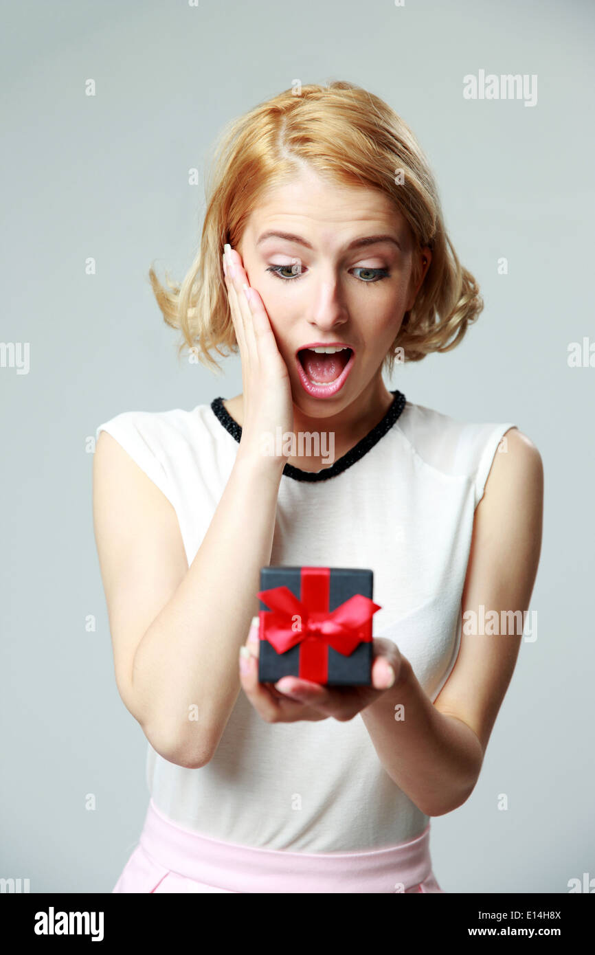 Surprised holding gift box hi-res stock photography and images - Alamy